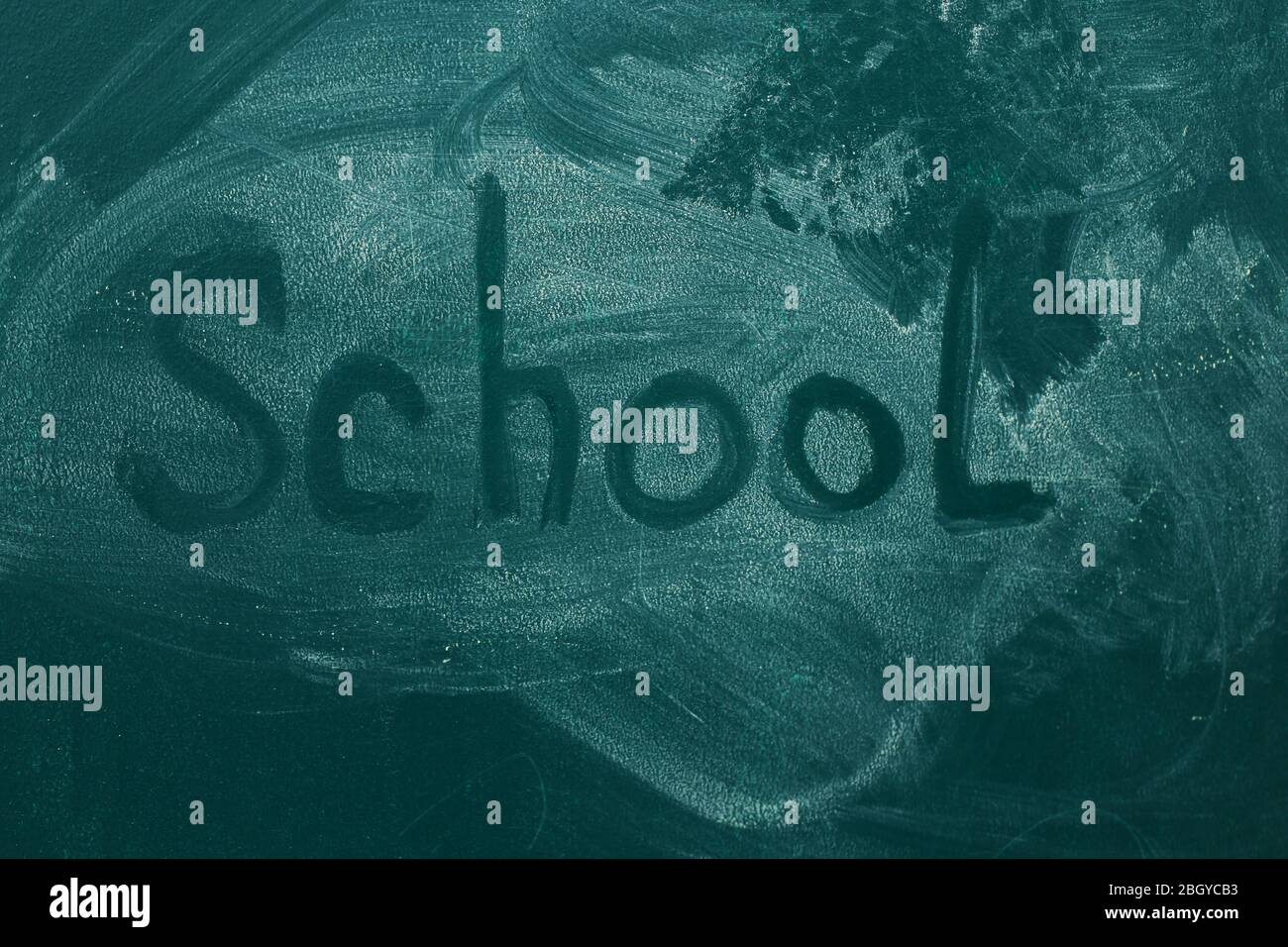 The word school written on blackboard close-up Stock Photo - Alamy