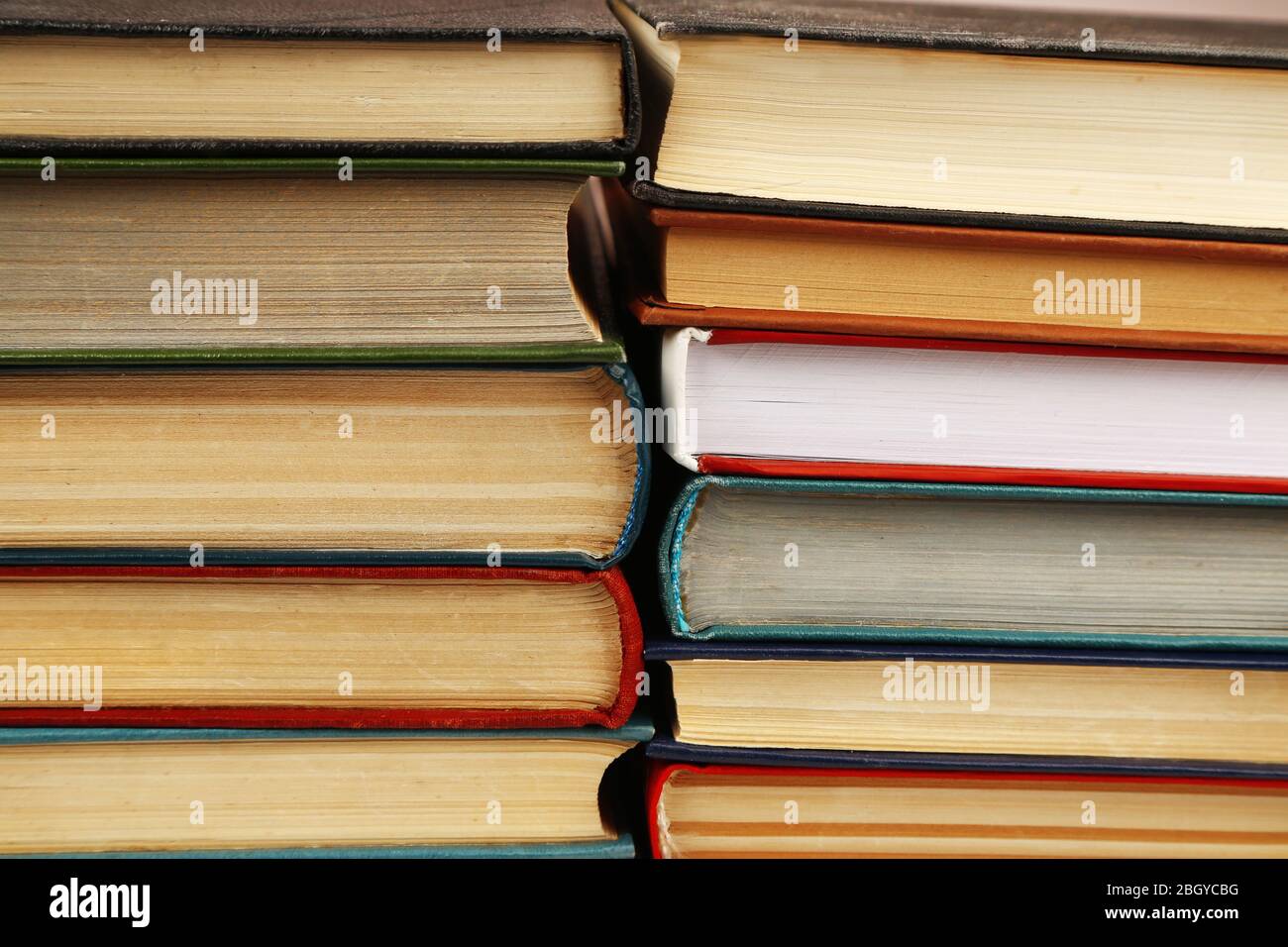 Pile of books, macro view Stock Photo - Alamy