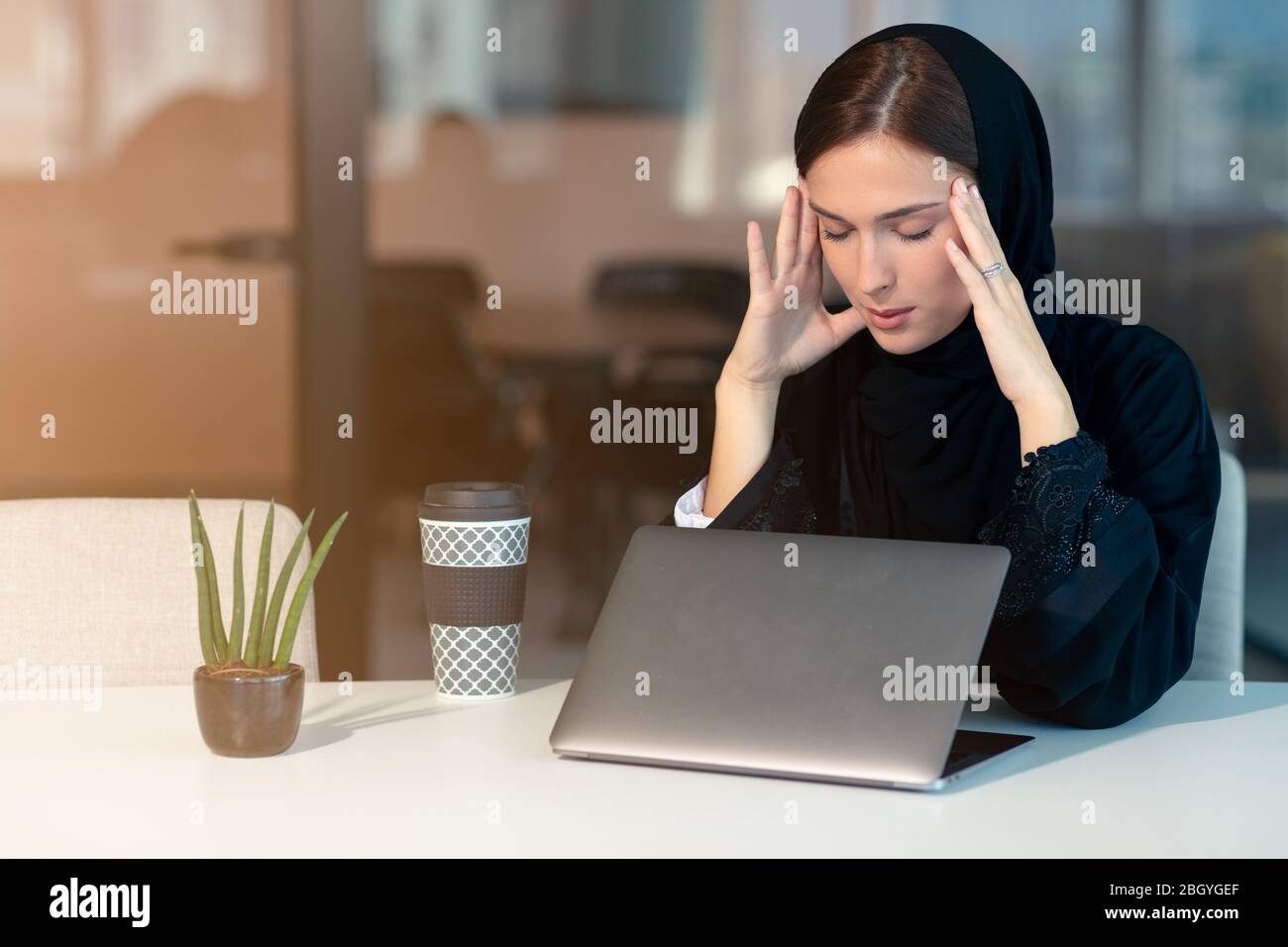 professional young female muslim worker having problem Stock Photo - Alamy