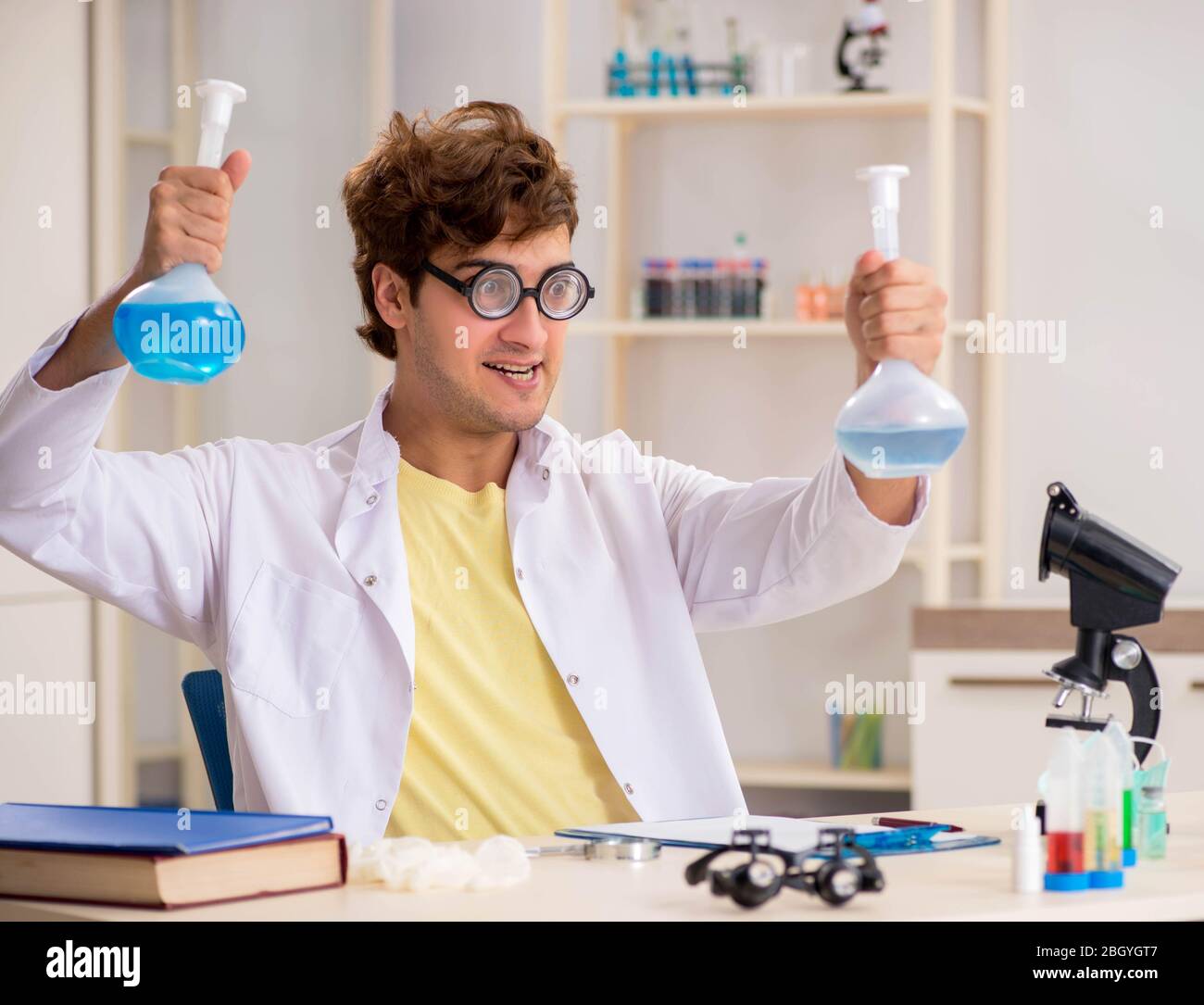 The funny crazy chemist doing experiments and tests Stock Photo - Alamy