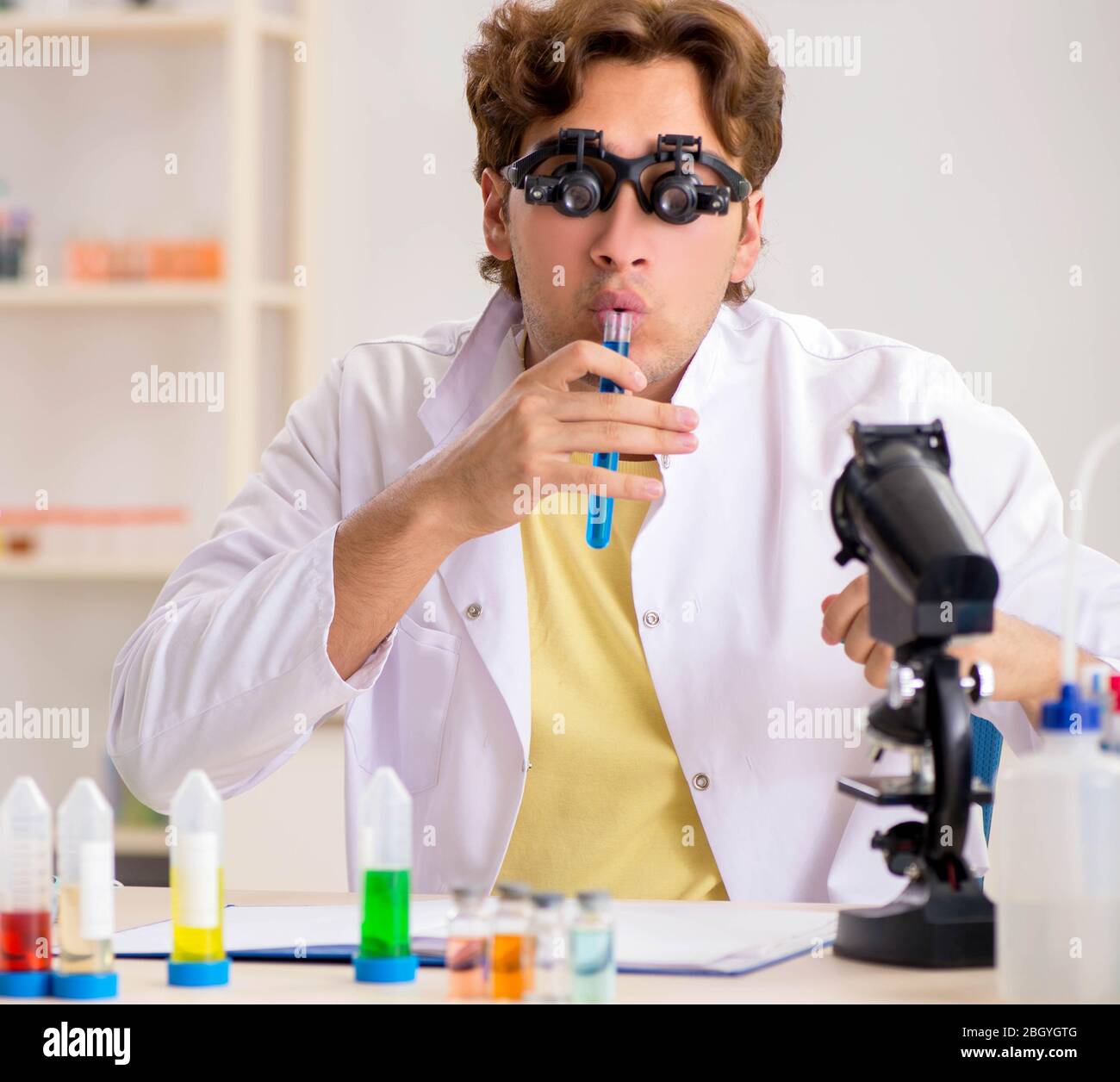 The funny crazy chemist doing experiments and tests Stock Photo - Alamy