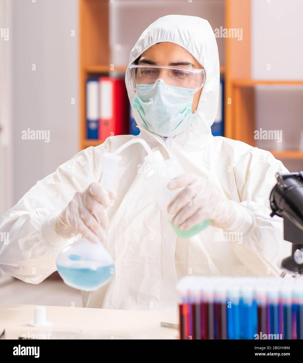 The young biochemist wearing protective suit working in the lab Stock ...