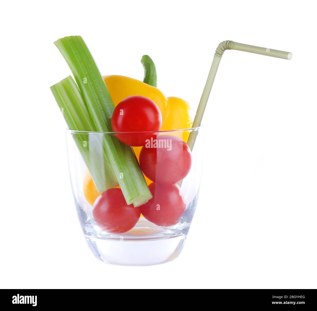 Vegetables in glass with tube isolated on white Stock Photo - Alamy
