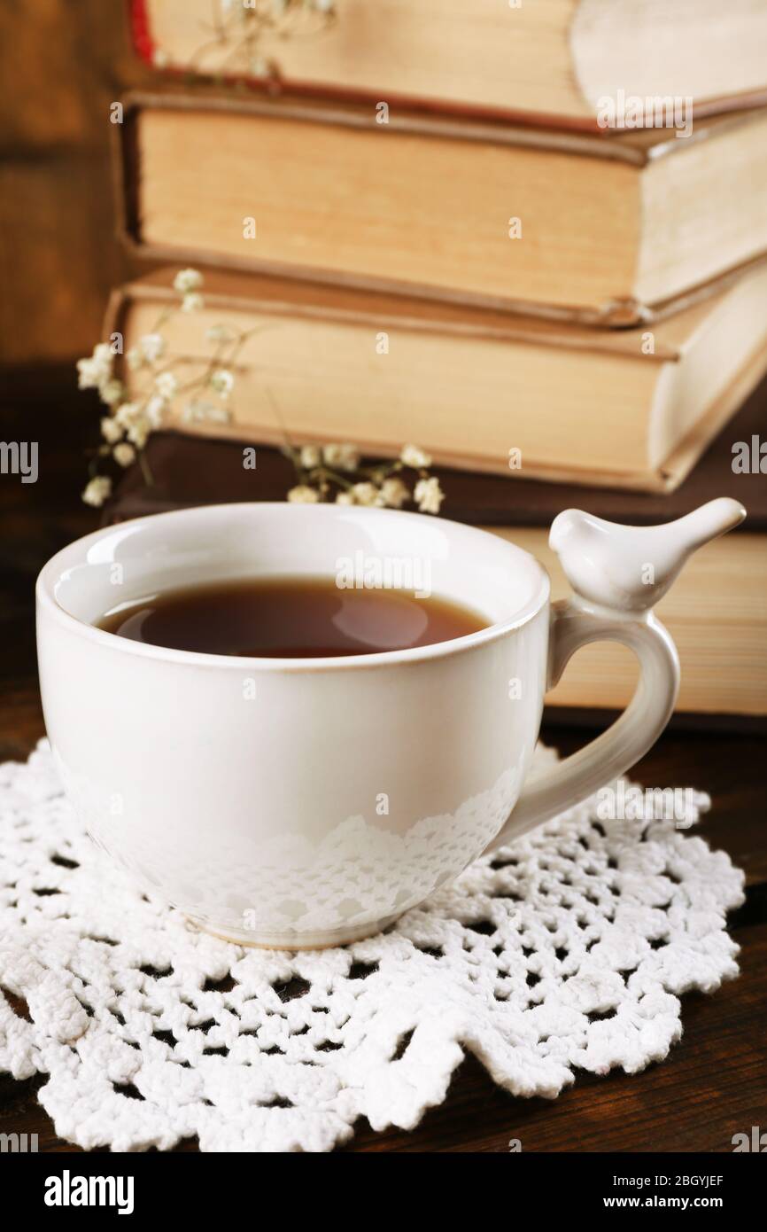 Pile book table teacup hi-res stock photography and images - Alamy