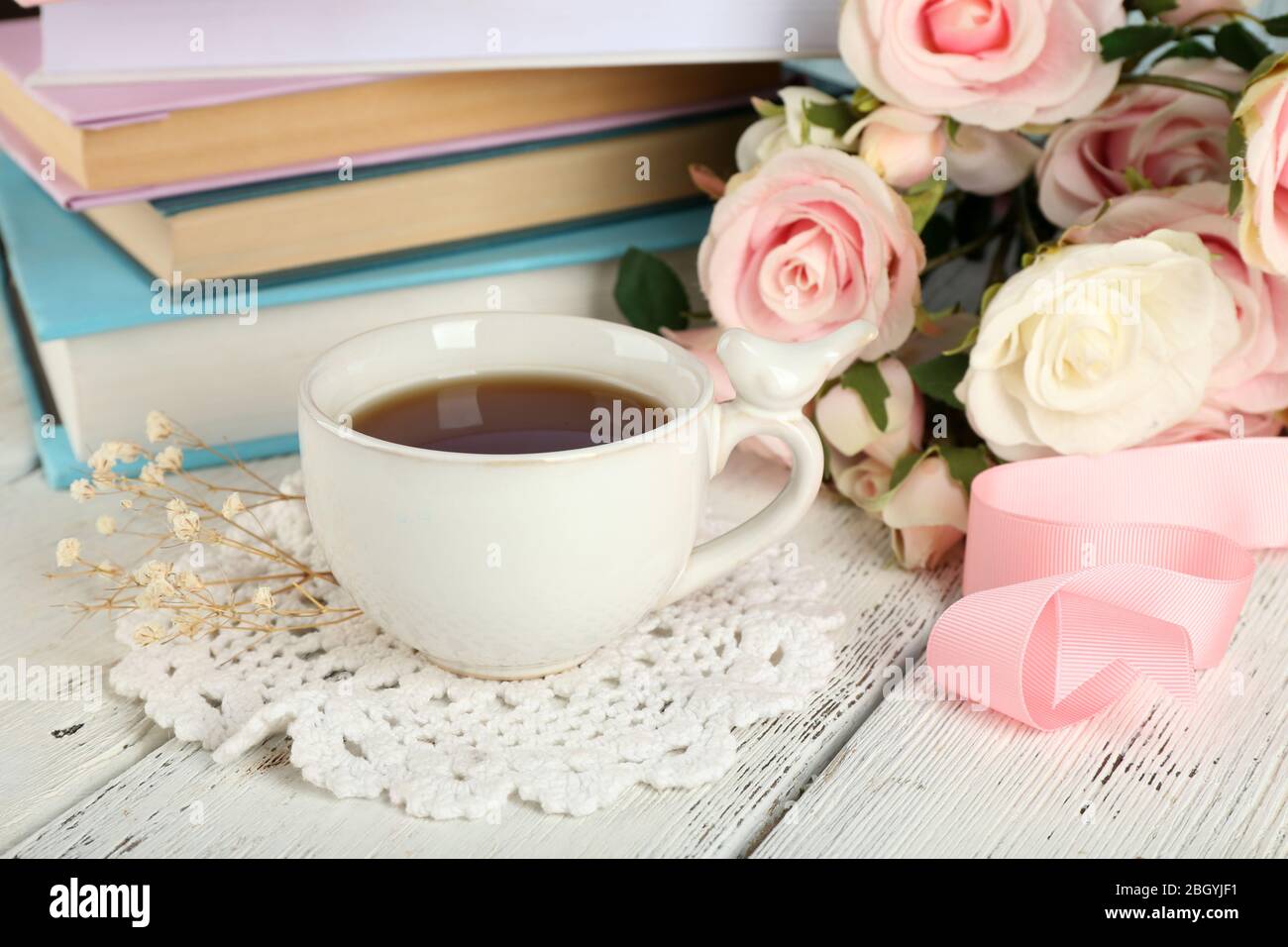 Pile book table teacup hi-res stock photography and images - Alamy