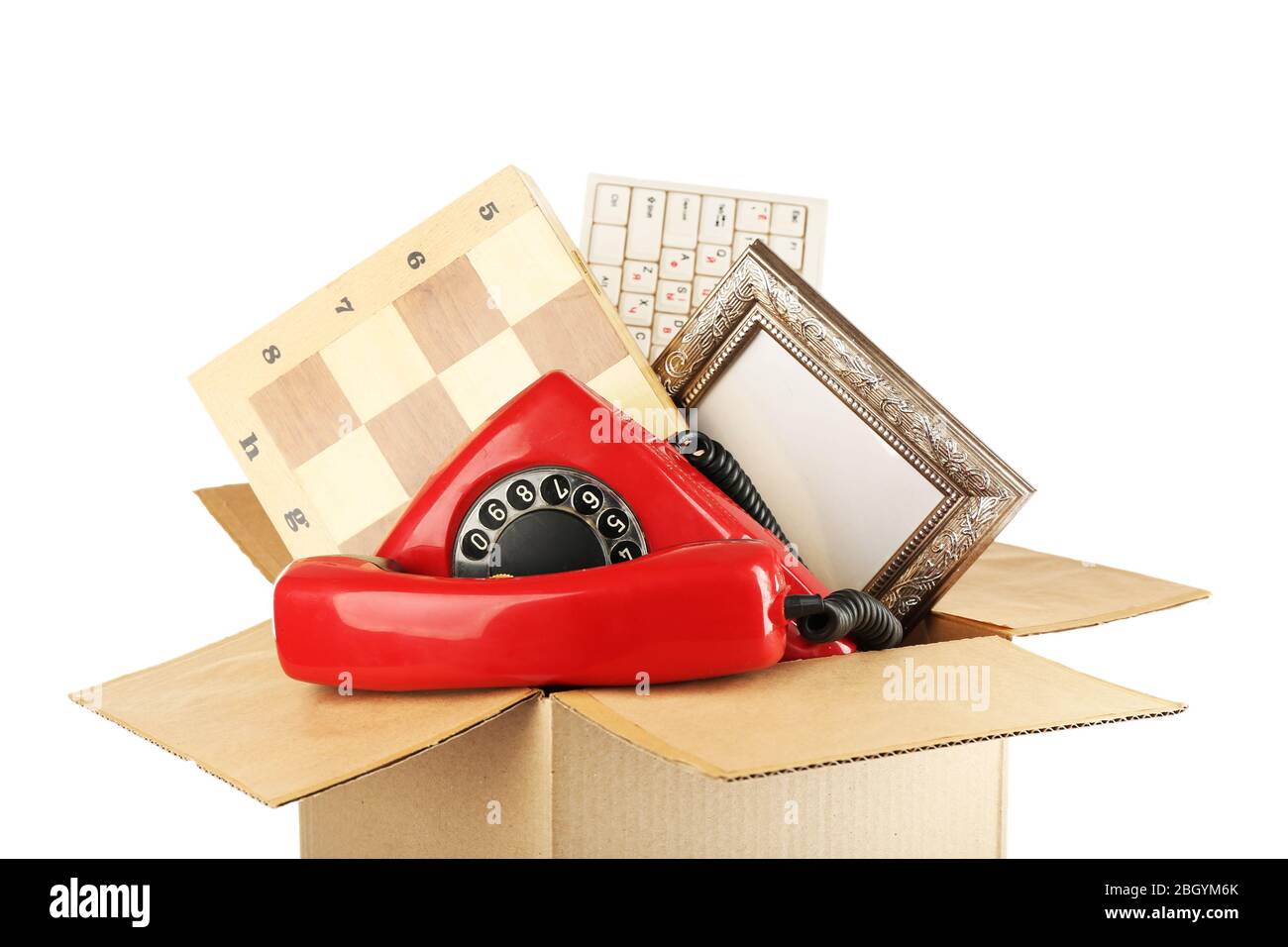 Box of unwanted stuff isolated on white Stock Photo - Alamy