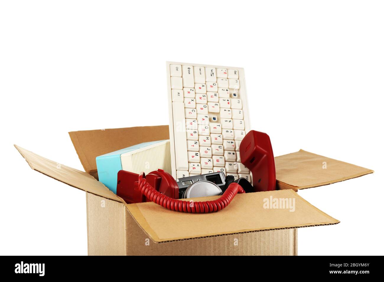Box of unwanted stuff isolated on white Stock Photo - Alamy