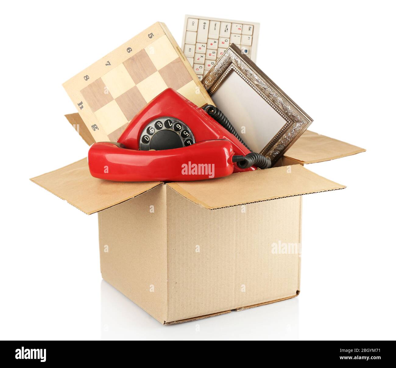 Box of unwanted stuff isolated on white Stock Photo - Alamy