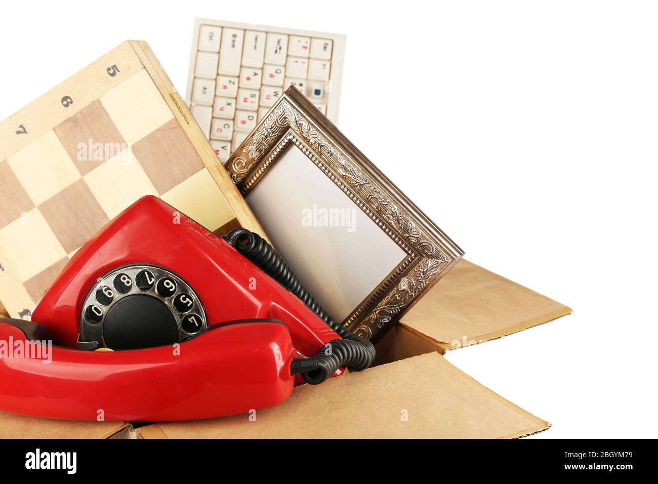 Box of unwanted stuff isolated on white Stock Photo - Alamy