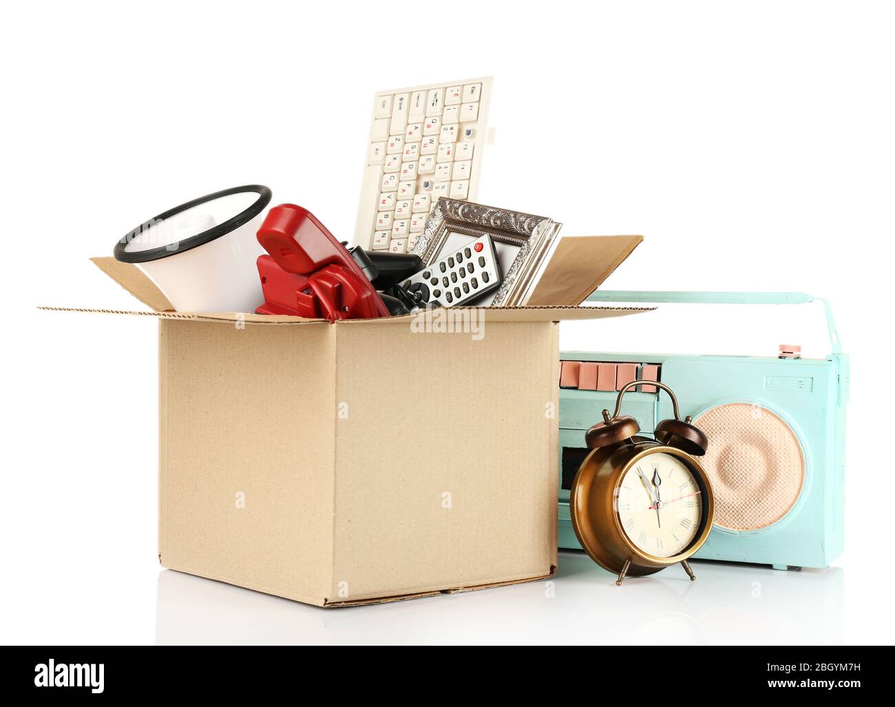 Box of unwanted stuff isolated on white Stock Photo - Alamy