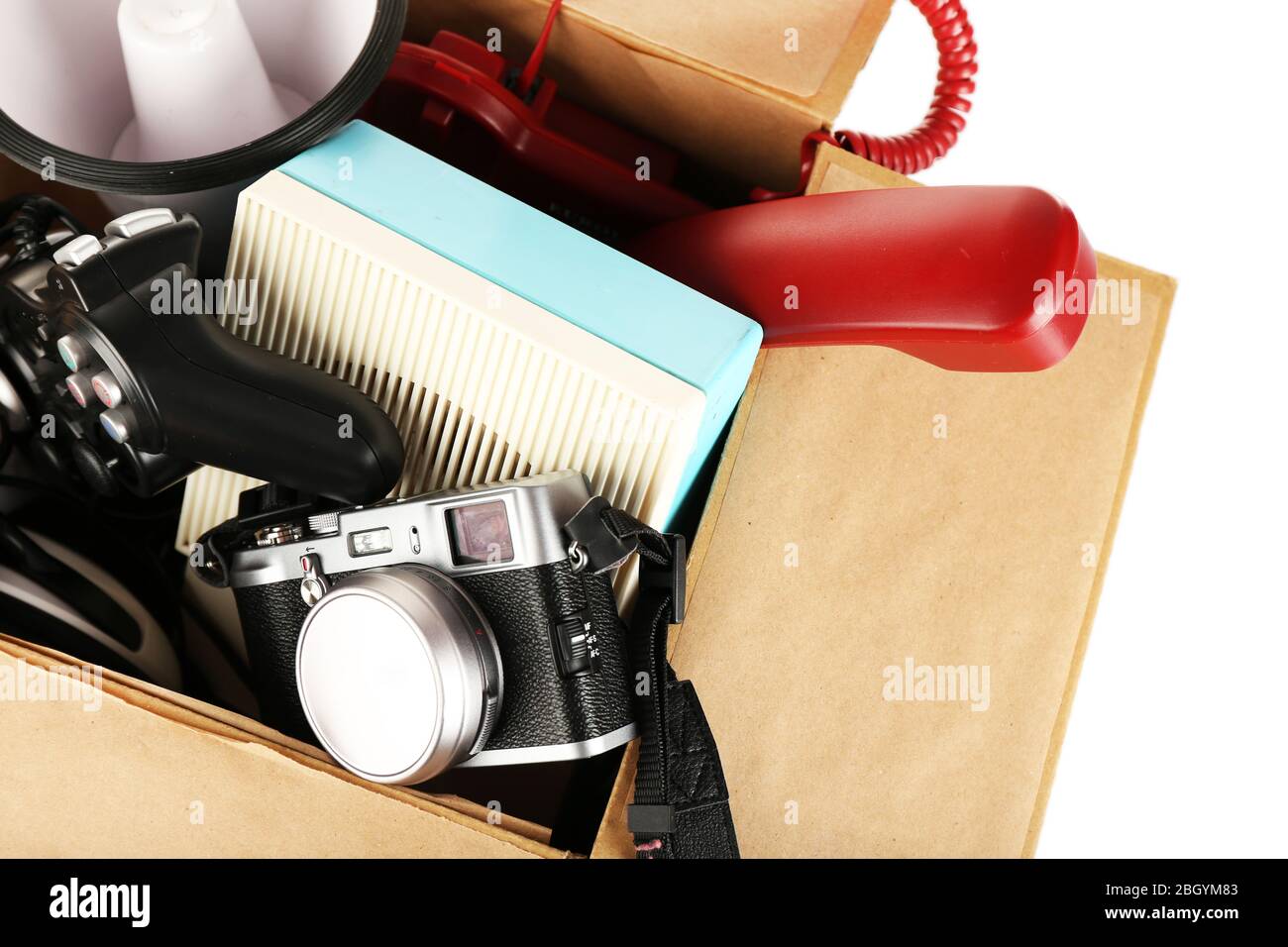 Box of unwanted stuff close up Stock Photo - Alamy