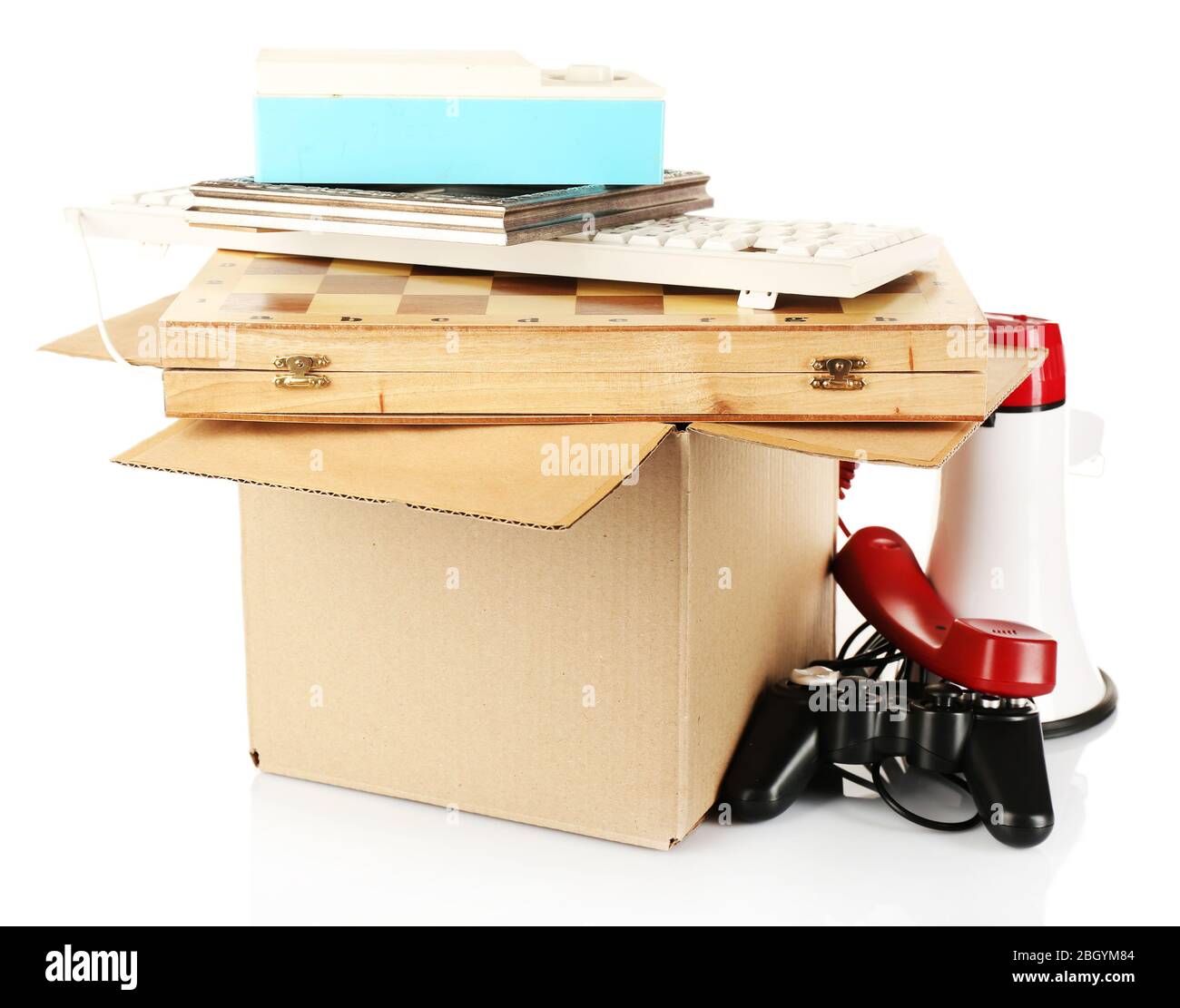 Box of unwanted stuff isolated on white Stock Photo - Alamy