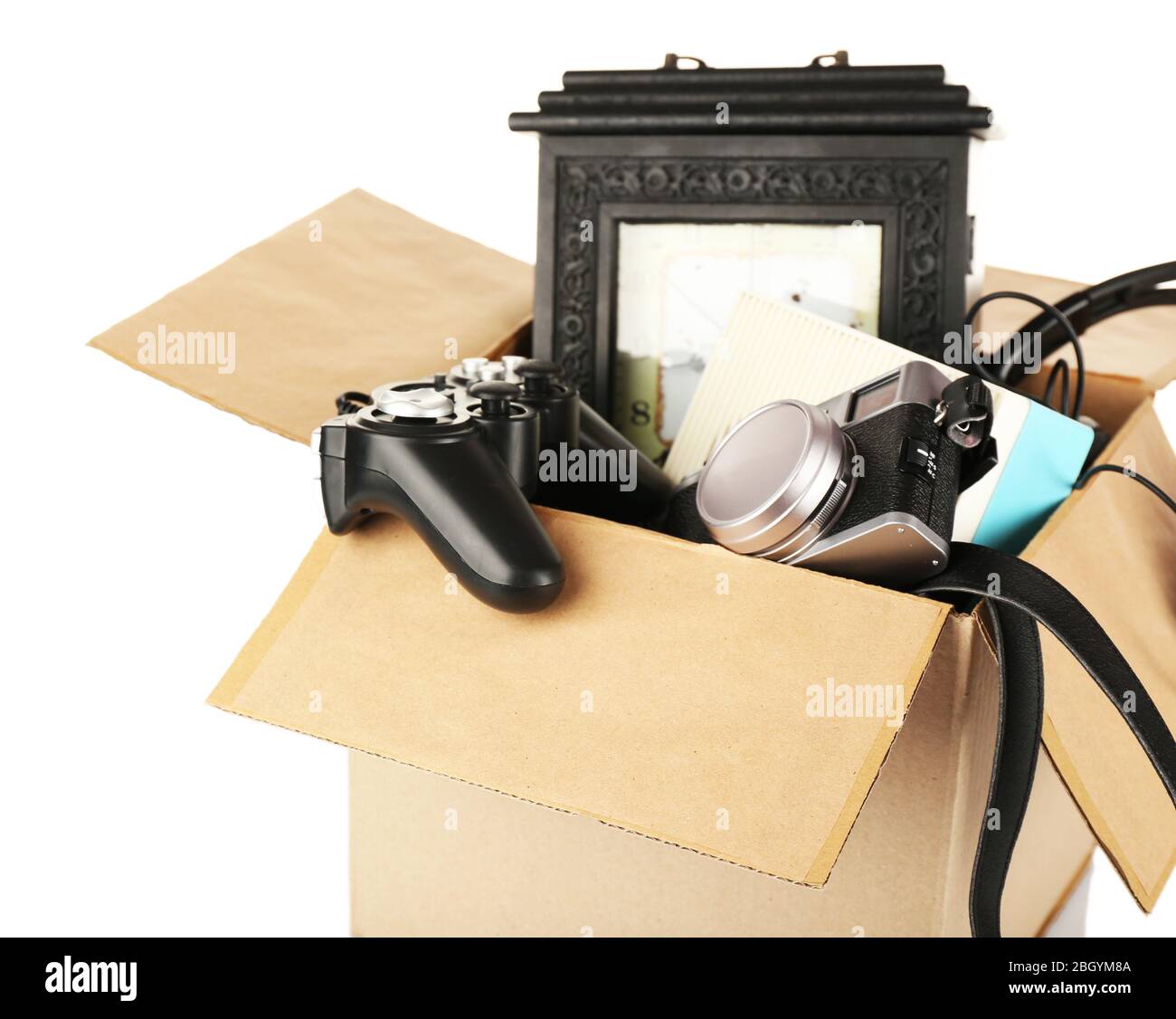 Box of unwanted stuff isolated on white Stock Photo - Alamy