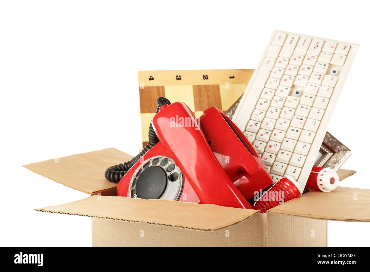 Box of unwanted stuff isolated on white Stock Photo - Alamy
