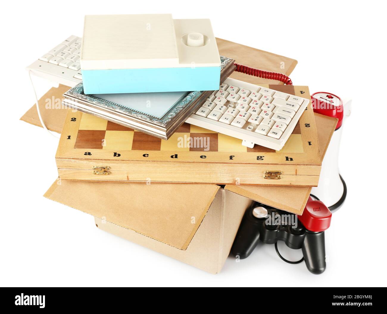 Box of unwanted stuff isolated on white Stock Photo - Alamy