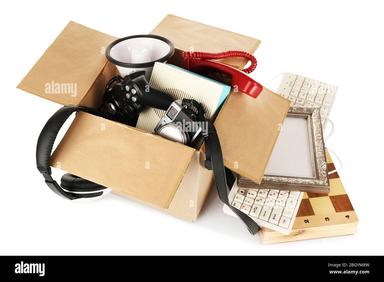 Box of unwanted stuff isolated on white Stock Photo - Alamy