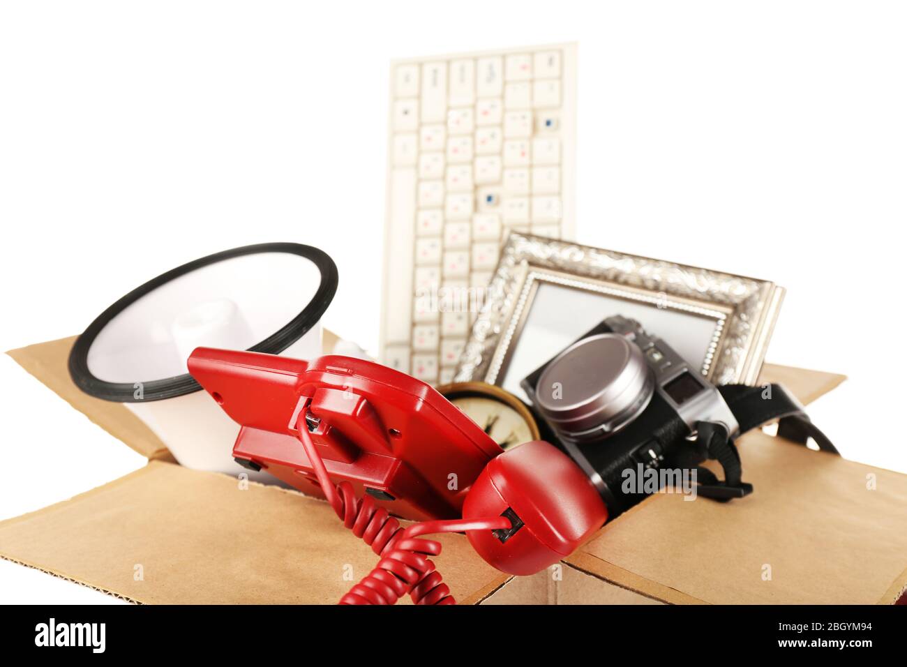 Box of unwanted stuff isolated on white Stock Photo - Alamy