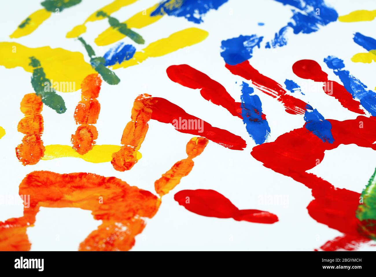 Hand prints of paint on white background Stock Photo - Alamy