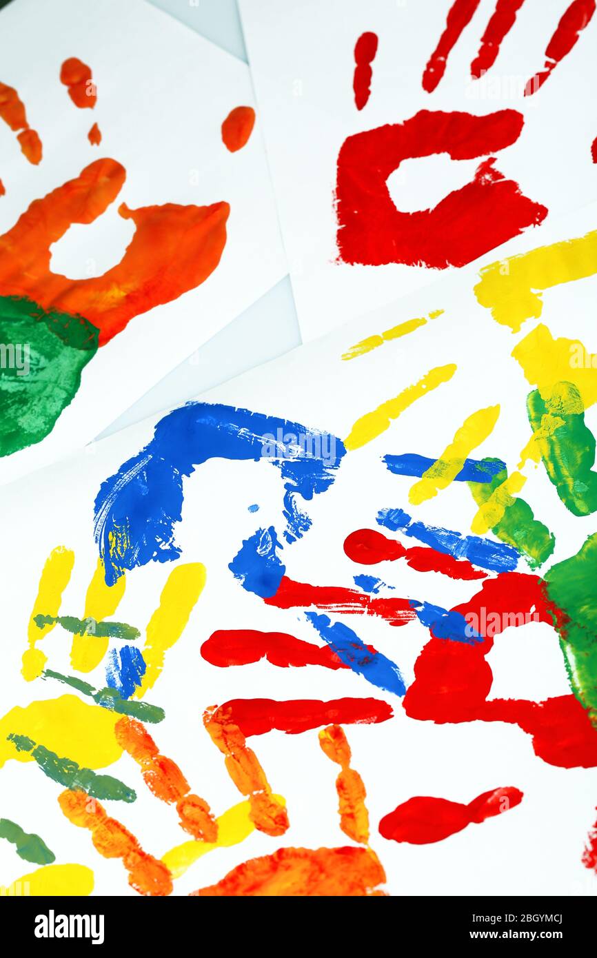 Hand prints of paint on white background Stock Photo - Alamy
