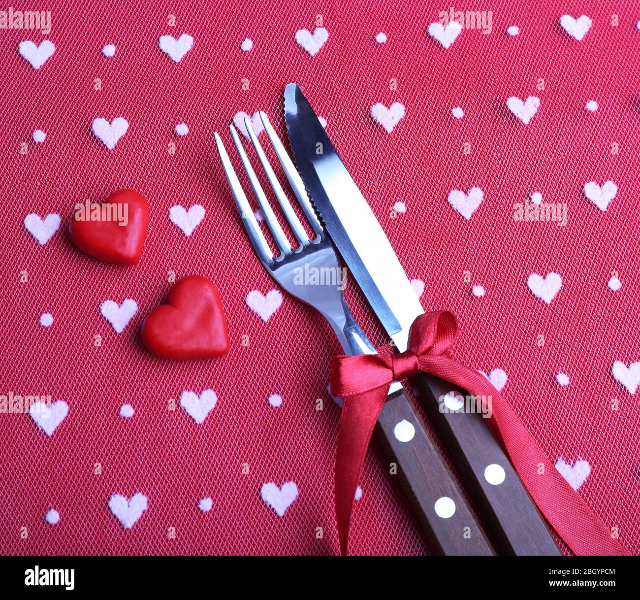 Cutlery set with decorative hearts Stock Photo - Alamy