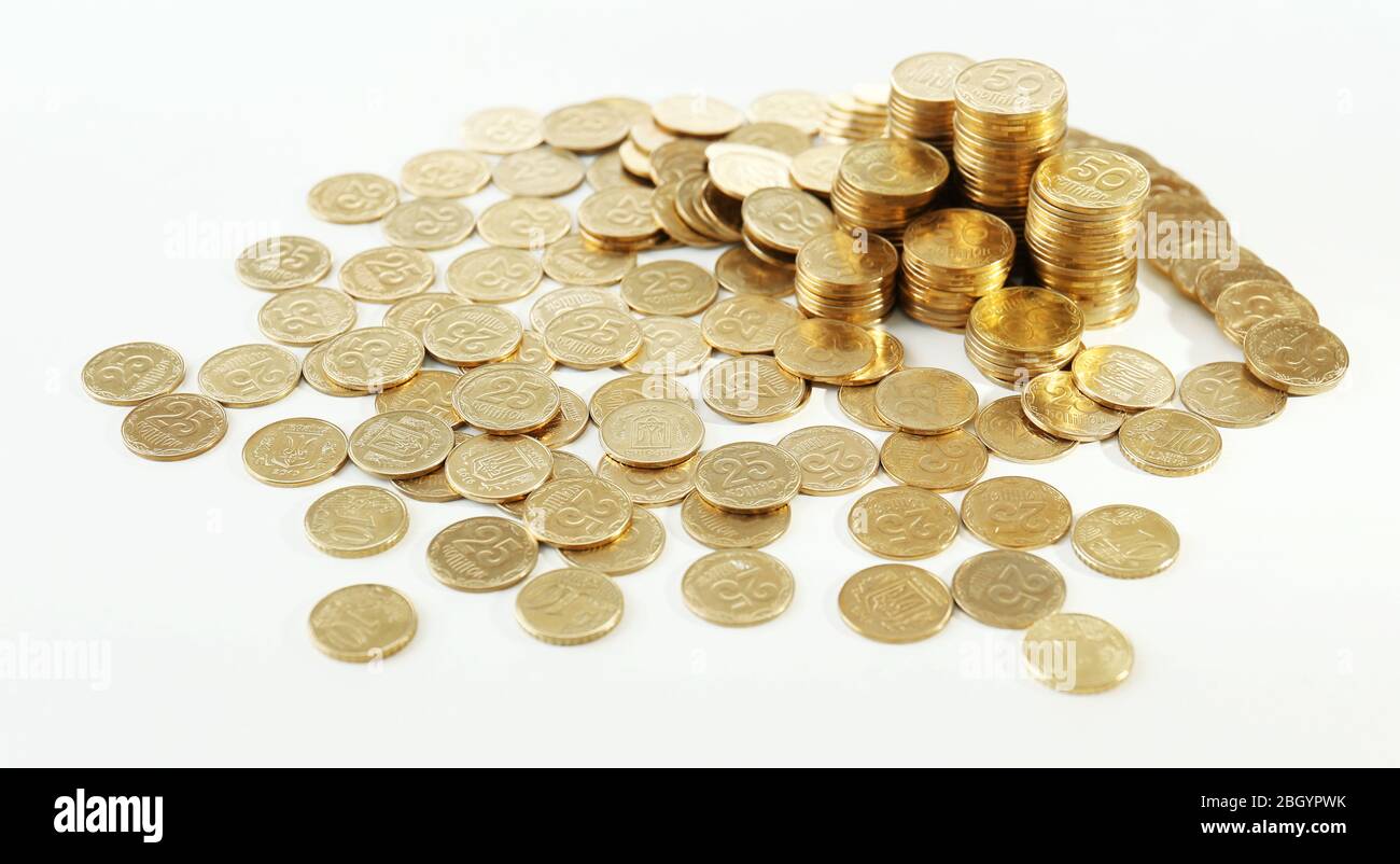 Pile of coins isolated on white Stock Photo - Alamy
