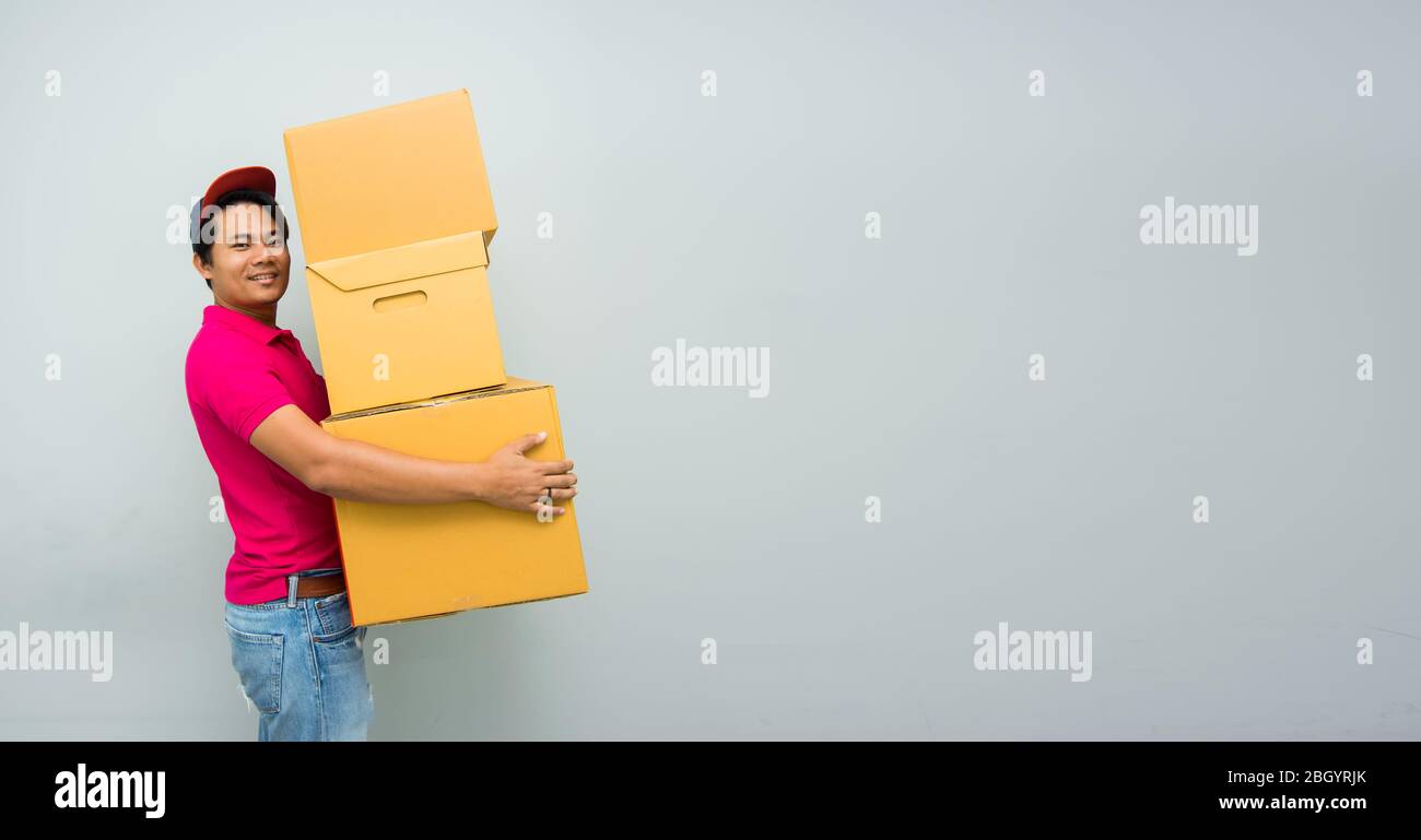 Young Asian Men delivery Services Carrying parcels on the chase and ...