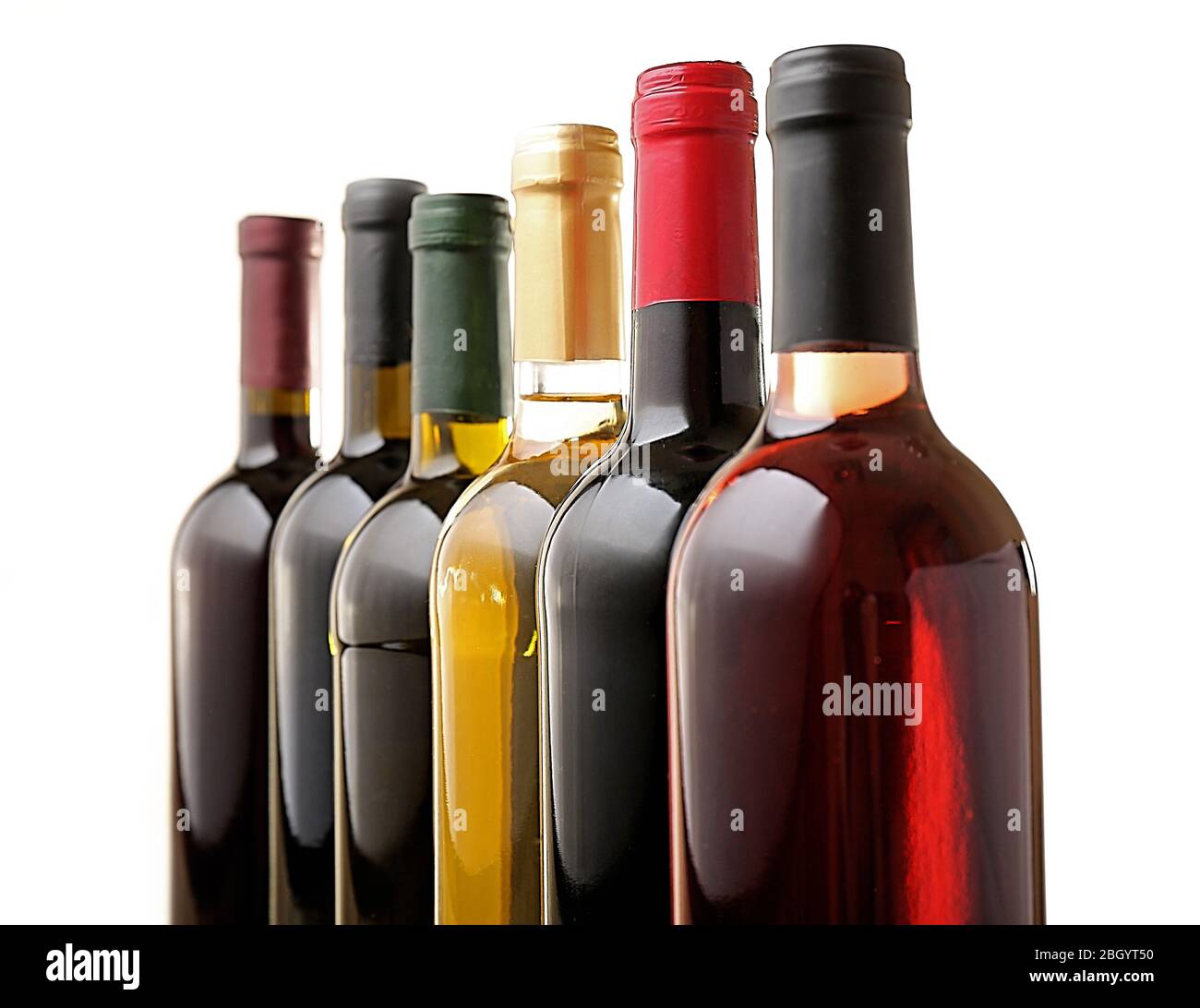 Wine bottles in row isolated on white Stock Photo - Alamy