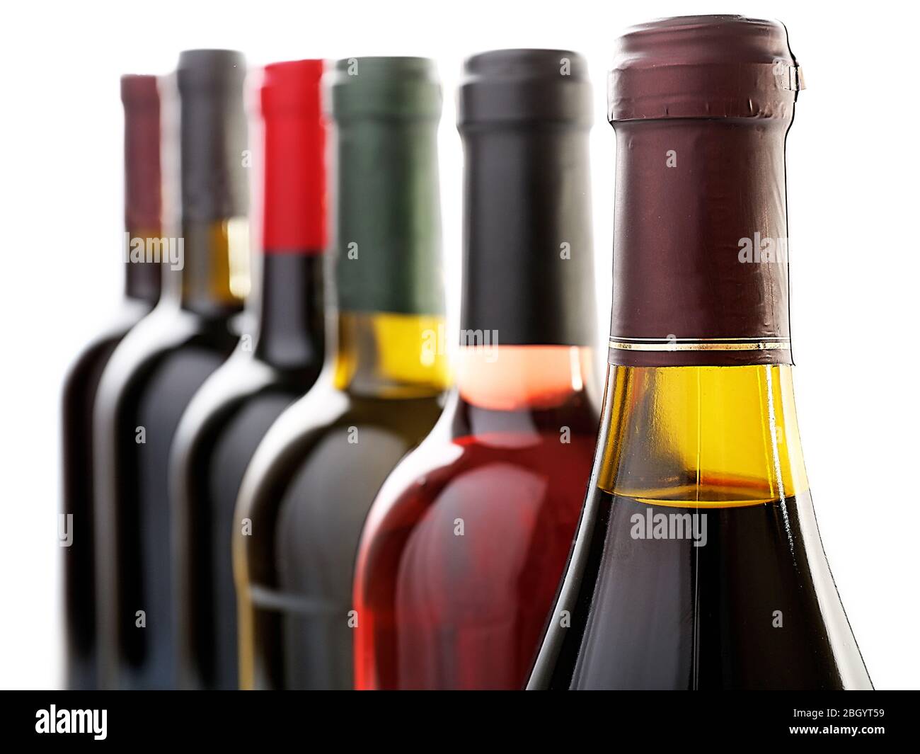 Wine bottles in row isolated on white Stock Photo - Alamy