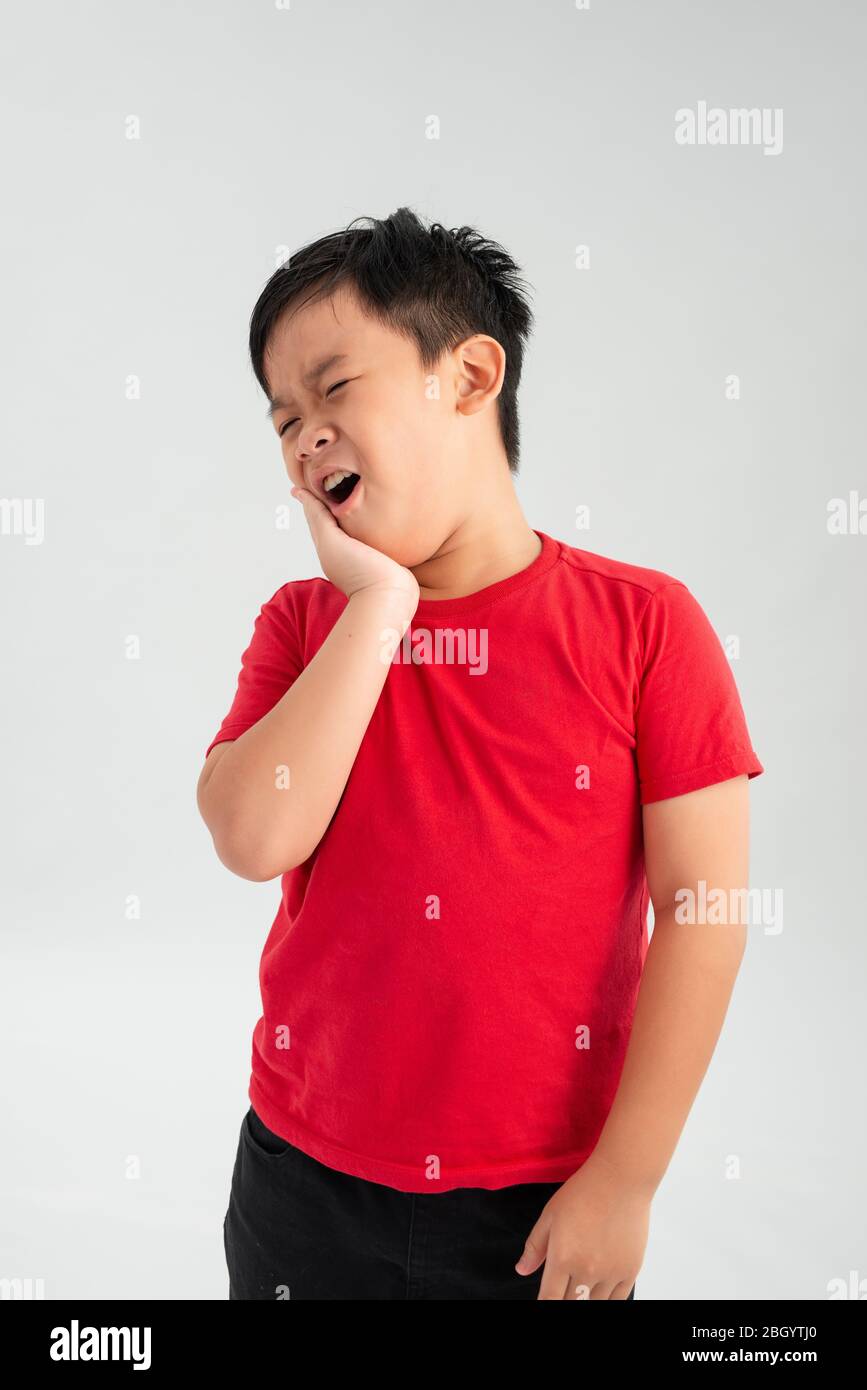 Little Asian boy suffering from toothache - Dental problem Stock Photo ...