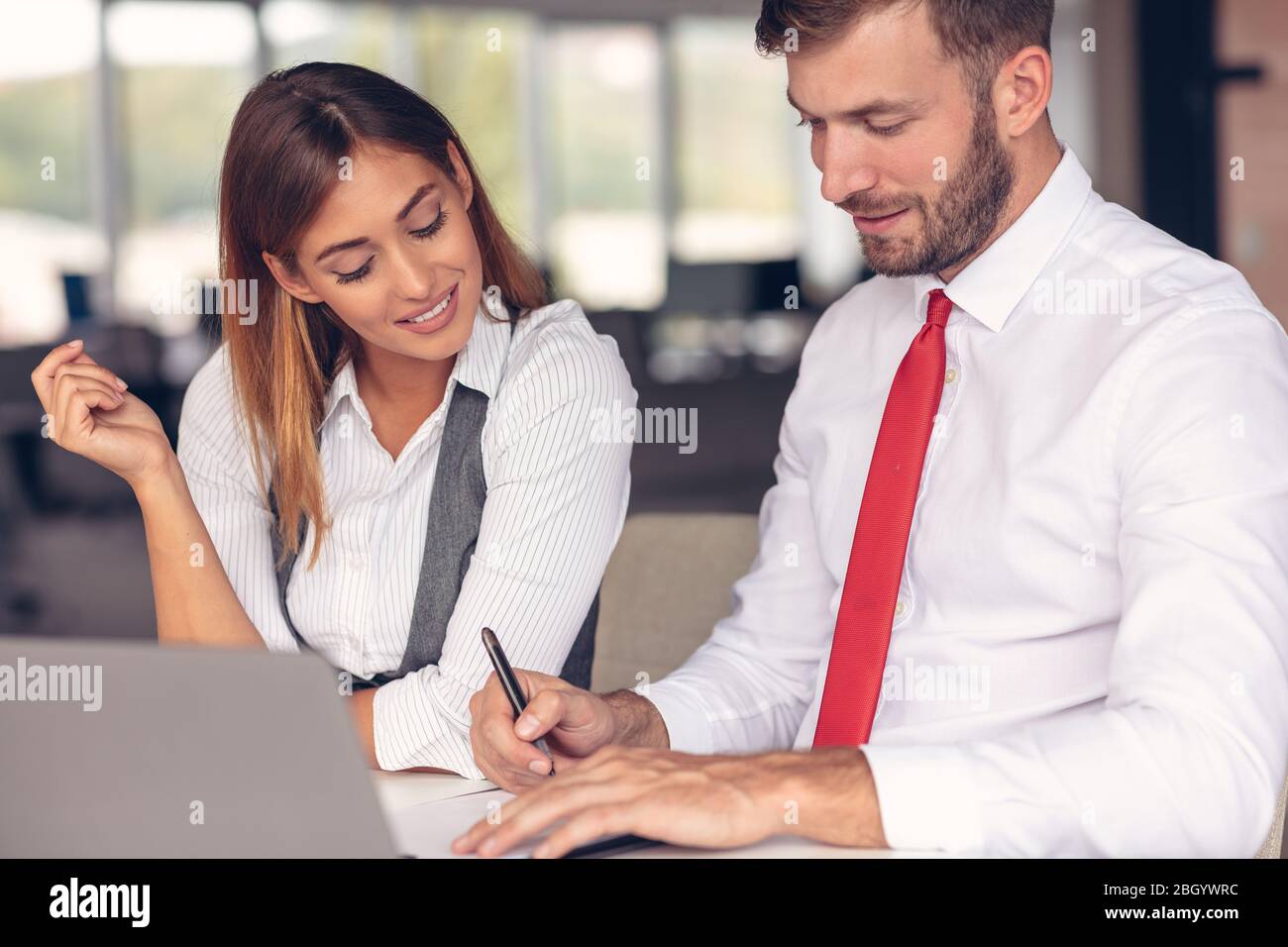 Young Business people working together on computer Stock Photo - Alamy