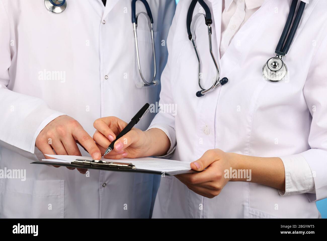 Two female doctors giving hi-res stock photography and images - Alamy