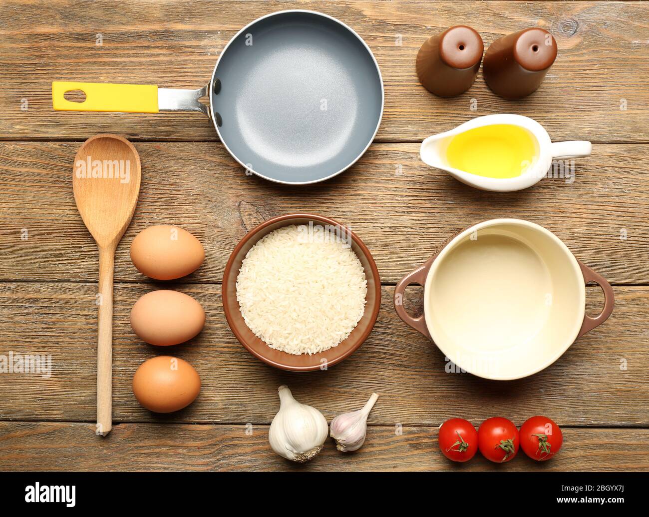 Food ingredients and kitchen utensils for cooking on wooden background ...
