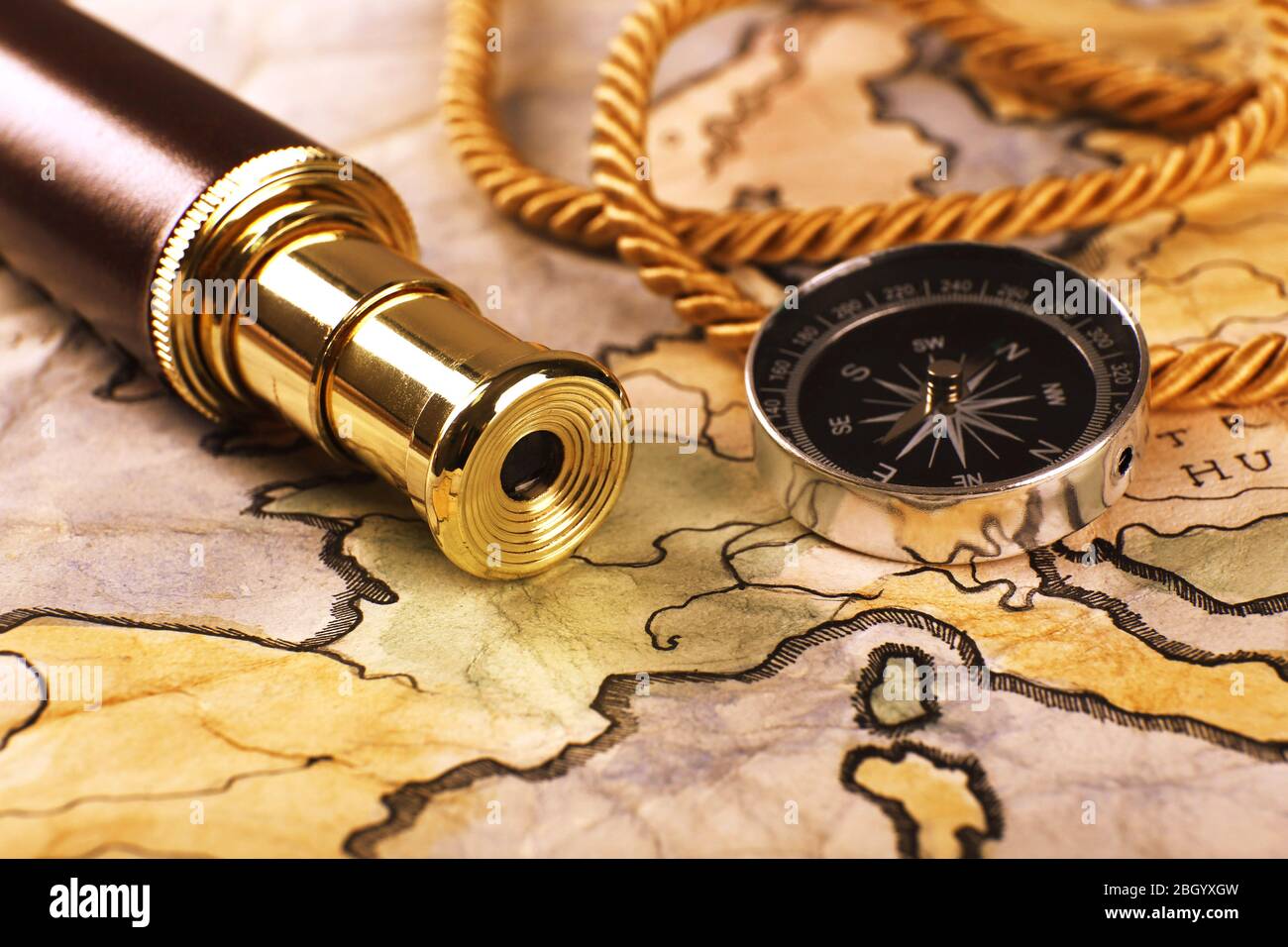 Marine still life with world map and spyglass on wooden table ...
