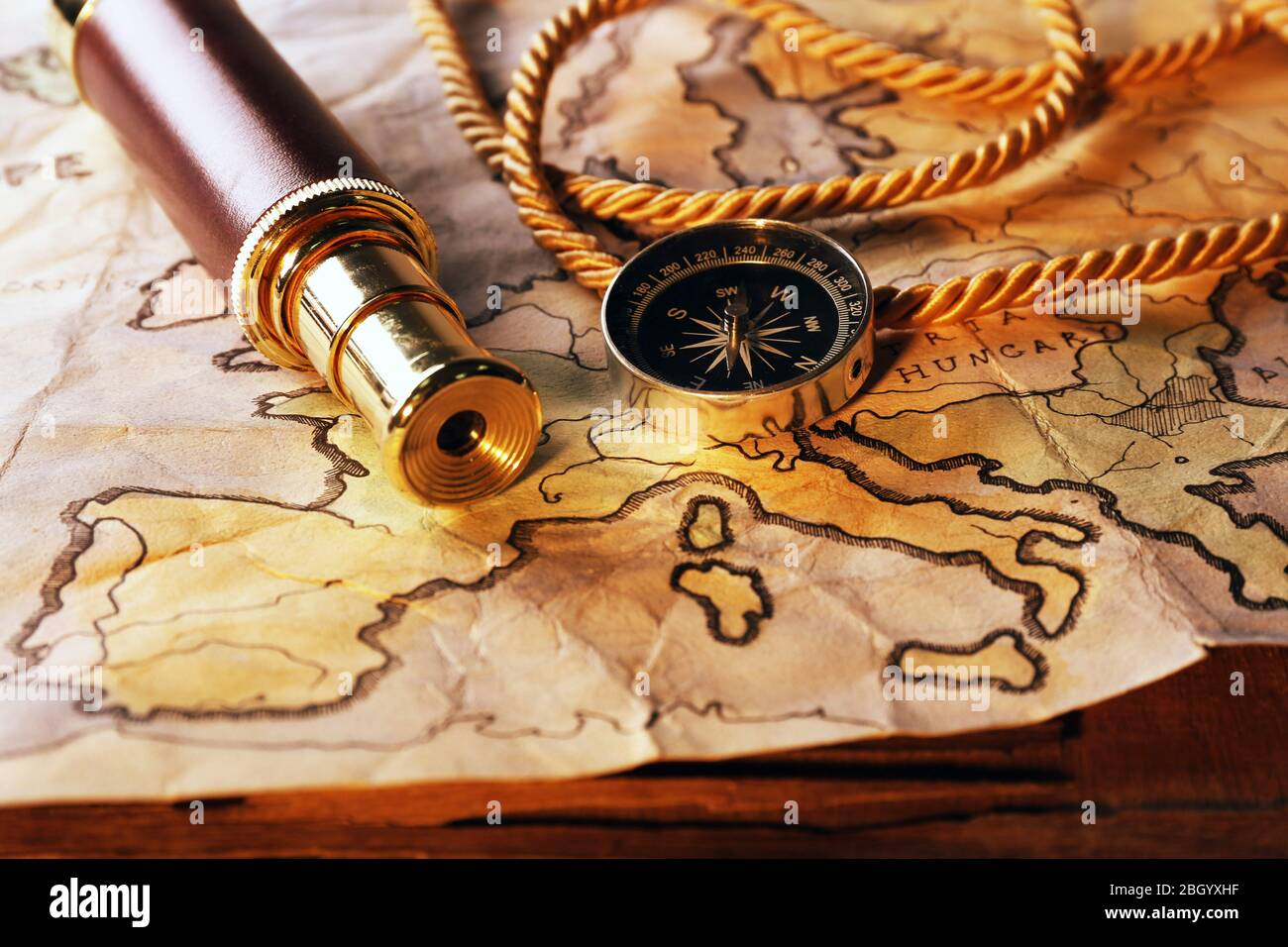 Marine still life with world map and spyglass on wooden table ...