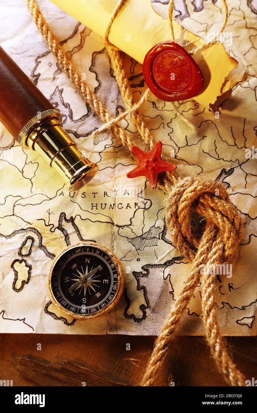 Marine still life with world map and rope on wooden table background ...