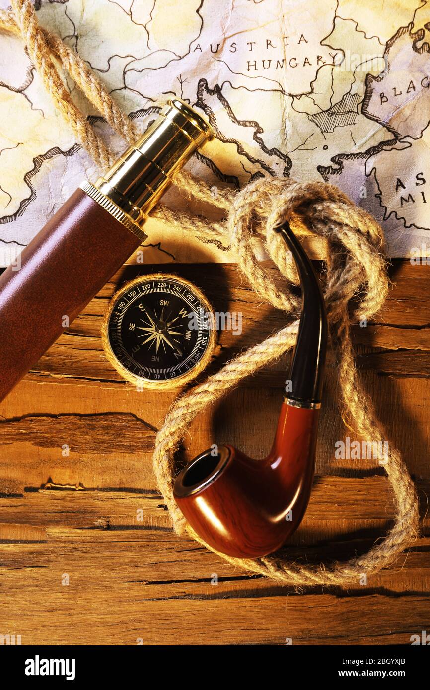 Marine still life with world map and rope on wooden table background ...