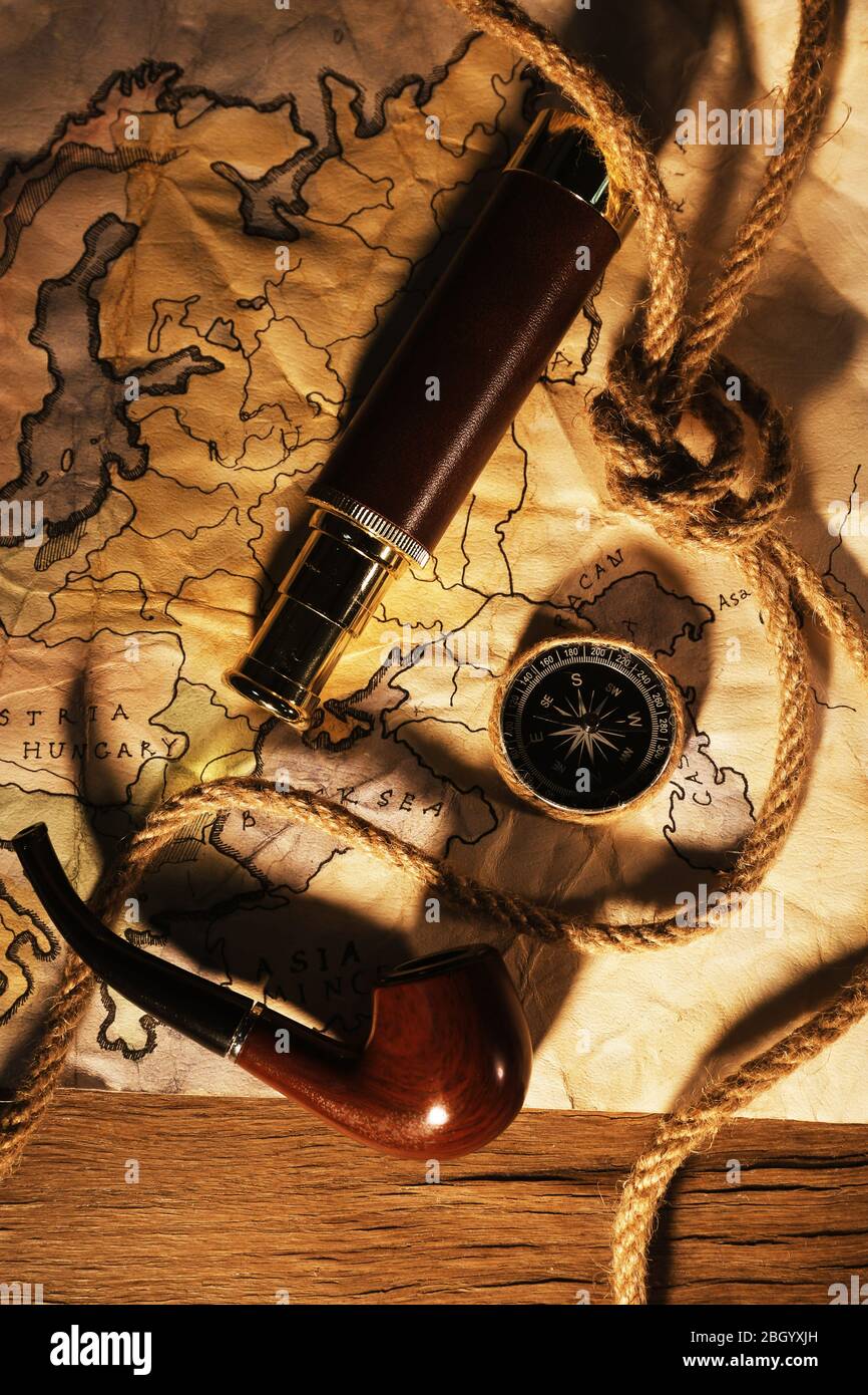 Marine still life with world map and rope on wooden table background ...