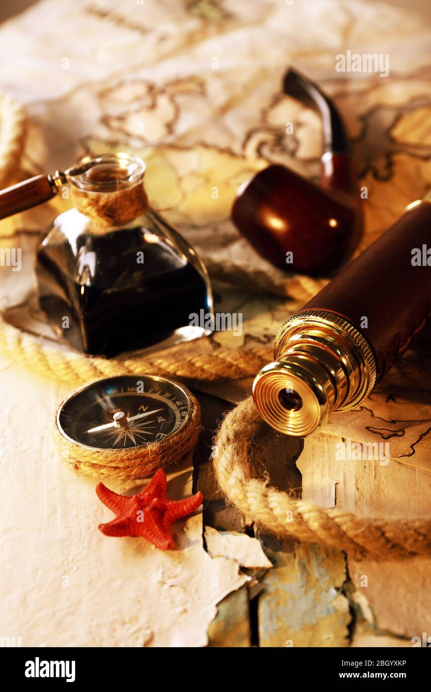 Marine still life spyglass and world map on old wooden background Stock ...