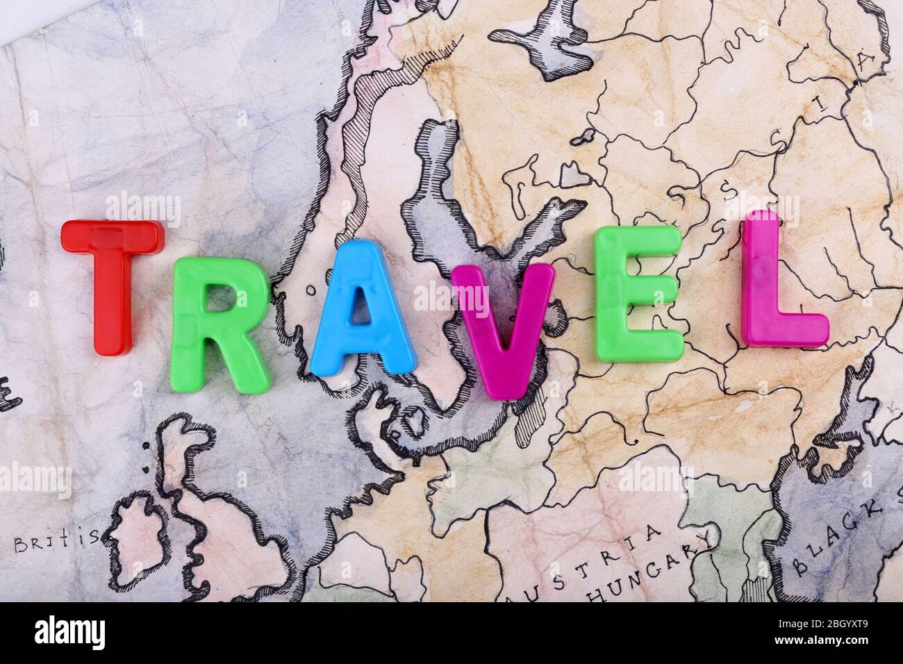 Colorful word Travel on World map background Stock Photo - Alamy