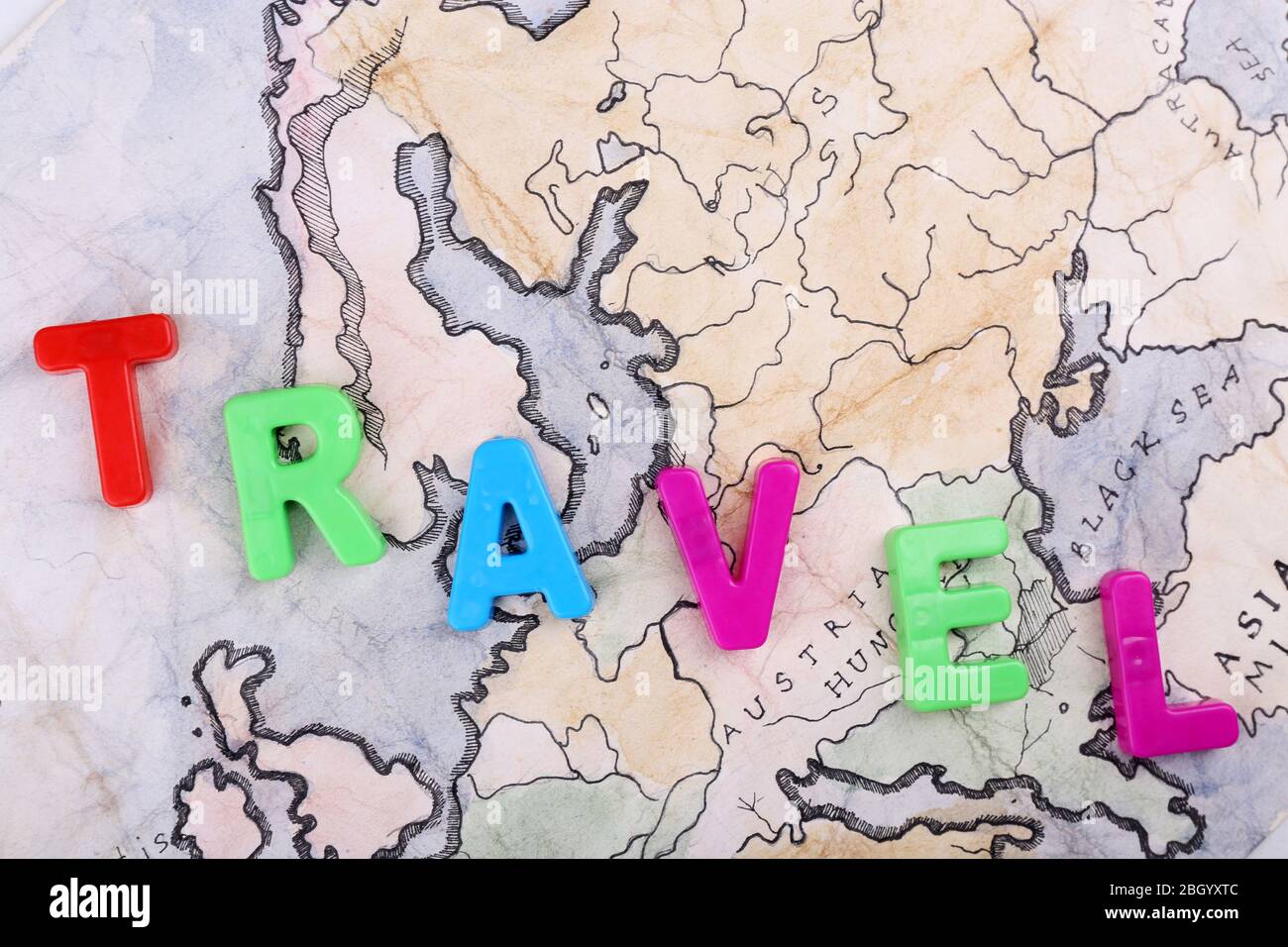 Colorful word Travel on World map background Stock Photo - Alamy