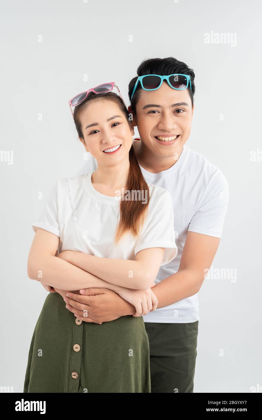 happy couple embracing, isolated on white background, man in glasses ...