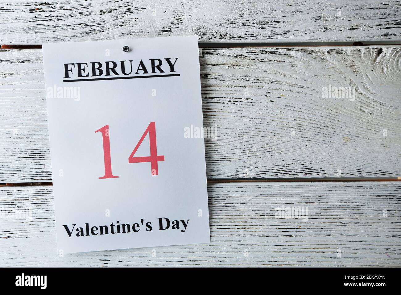 Valentines Day, February 14 on calendar on wooden background Stock ...