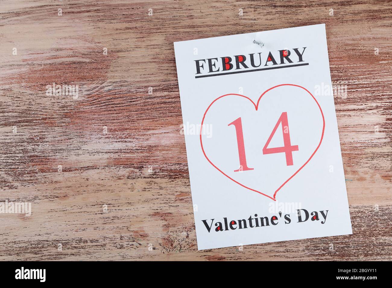 Valentines Day, February 14 on calendar on wooden background Stock ...