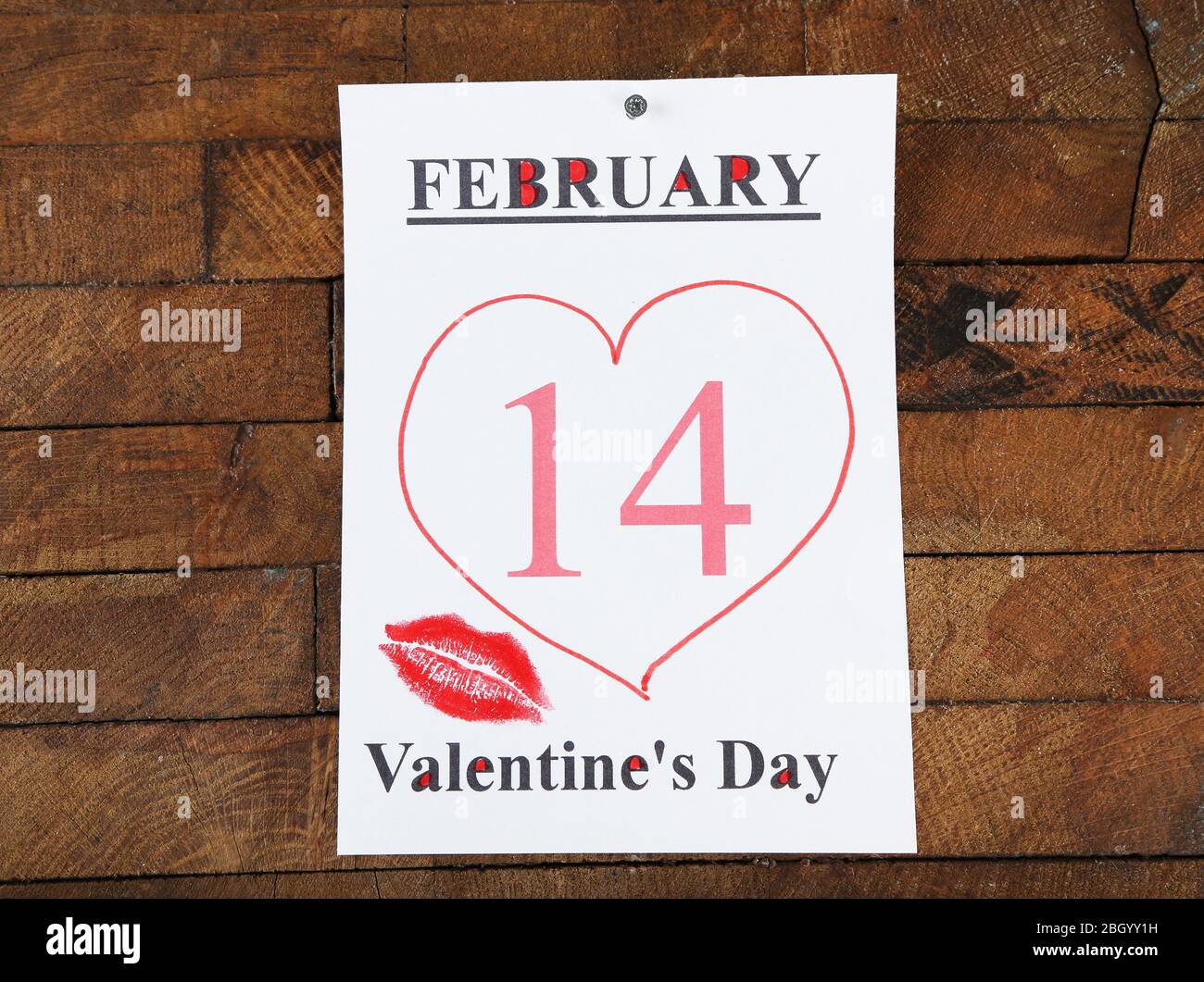 Valentines Day, February 14 on calendar on wooden background Stock ...