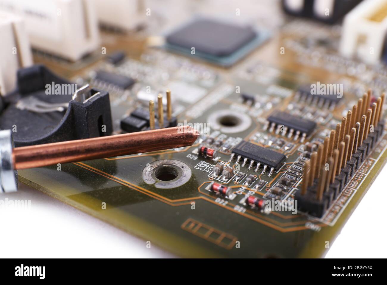 Motherboard repairing on white background Stock Photo - Alamy