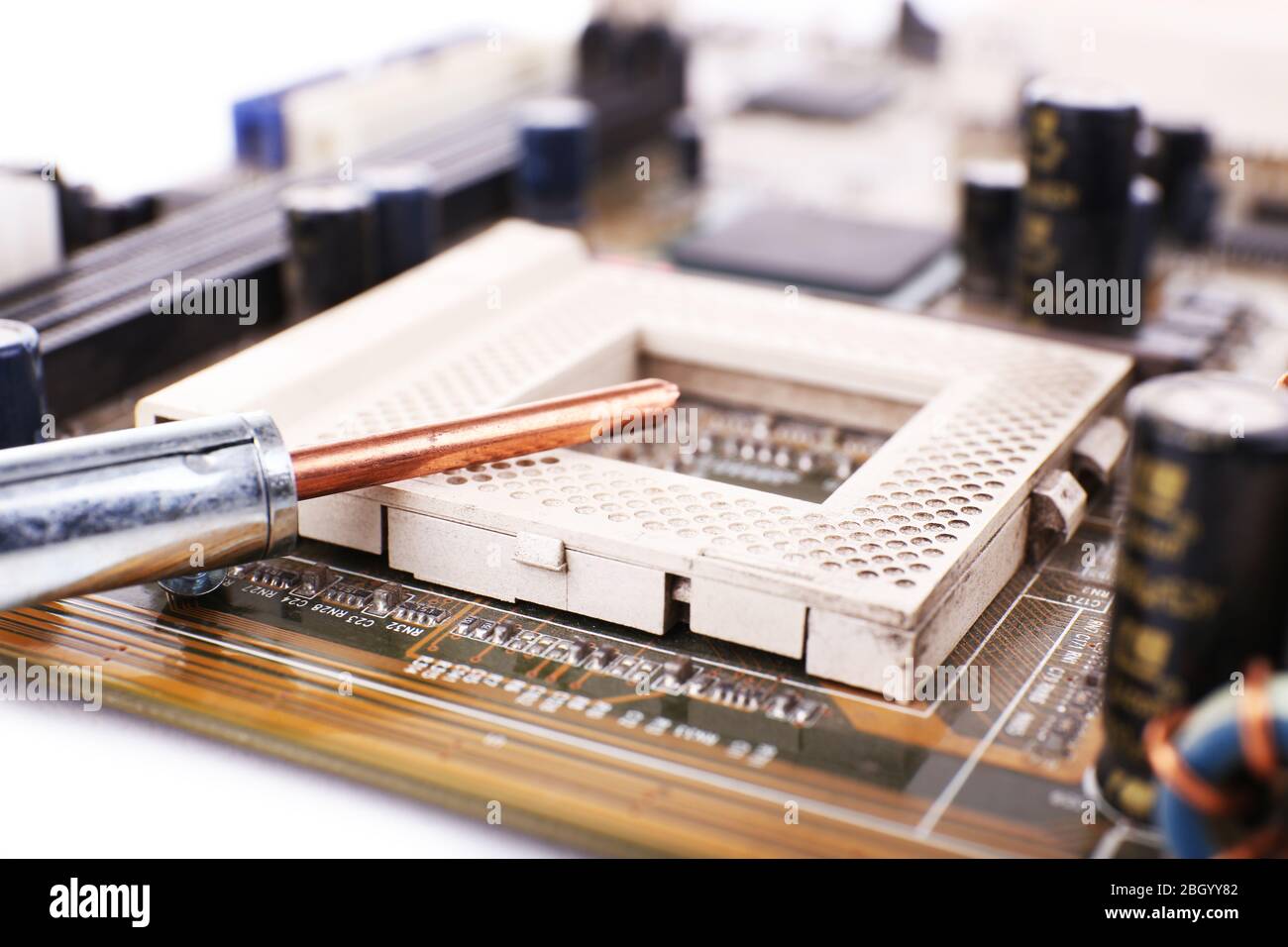Motherboard repairing on white background Stock Photo - Alamy