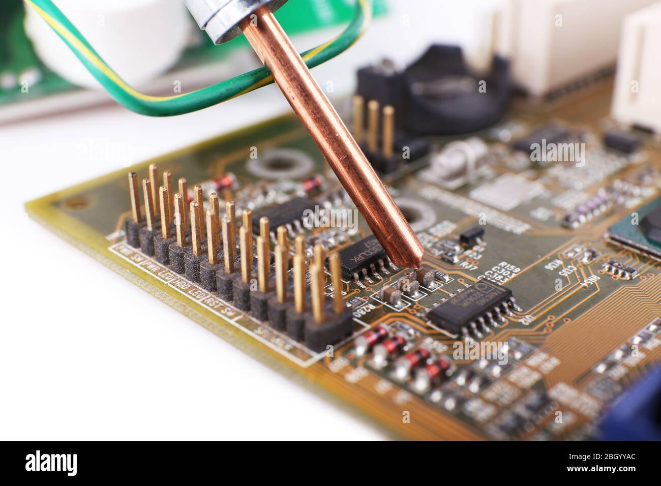 Motherboard repairing on white background Stock Photo - Alamy