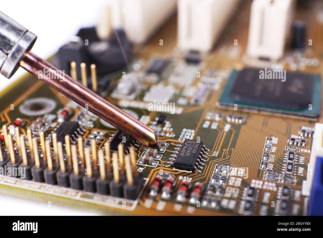 Motherboard repairing on white background Stock Photo - Alamy