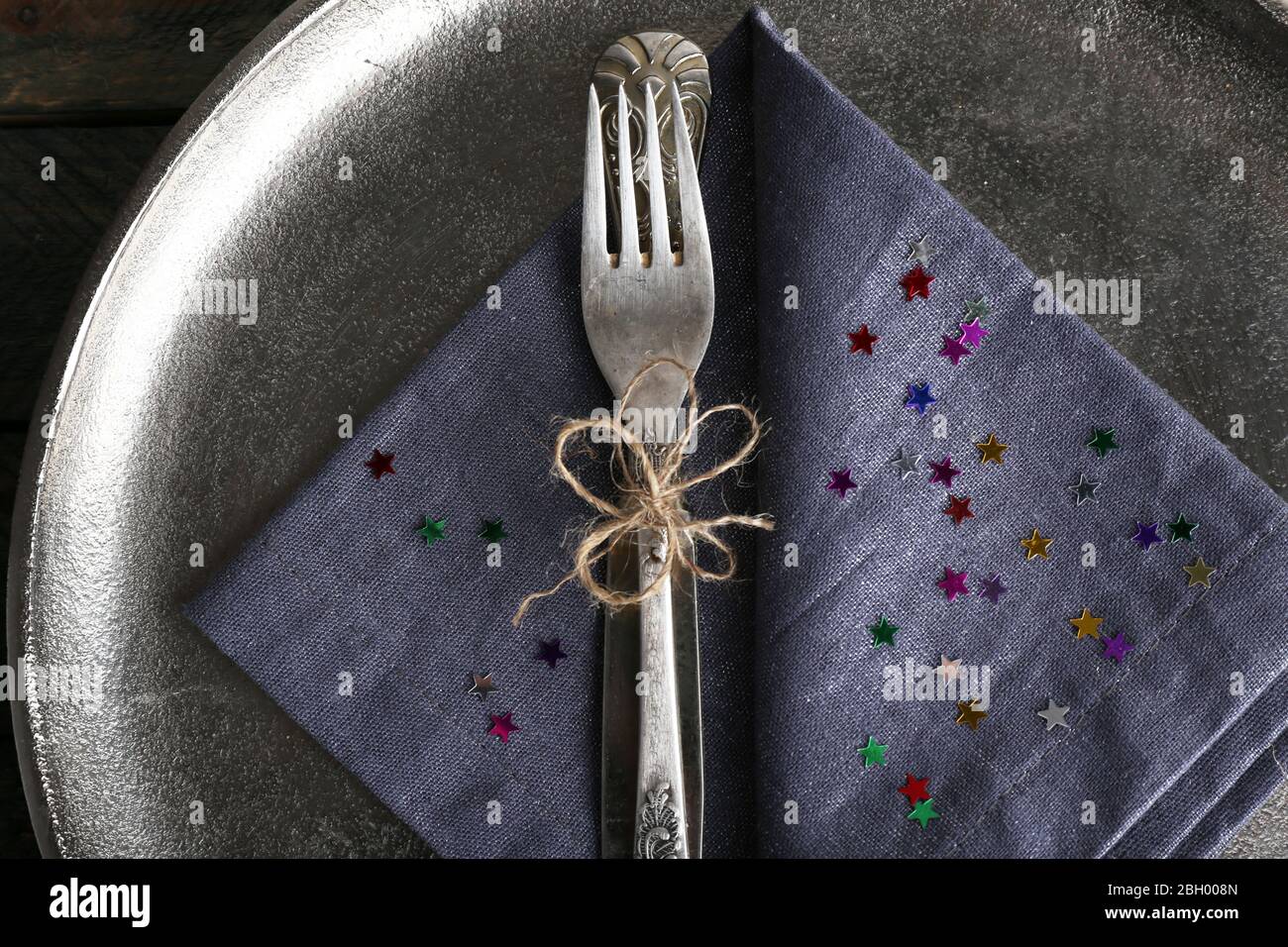 Silverware tied with rope on napkin and metal tray background Stock ...