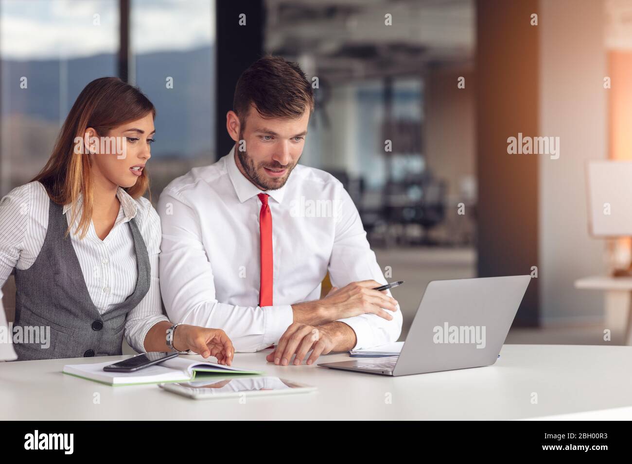 Young Business people working together on computer Stock Photo - Alamy